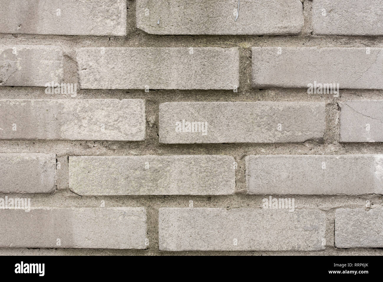 old grey brick wall background texture Stock Photo - Alamy