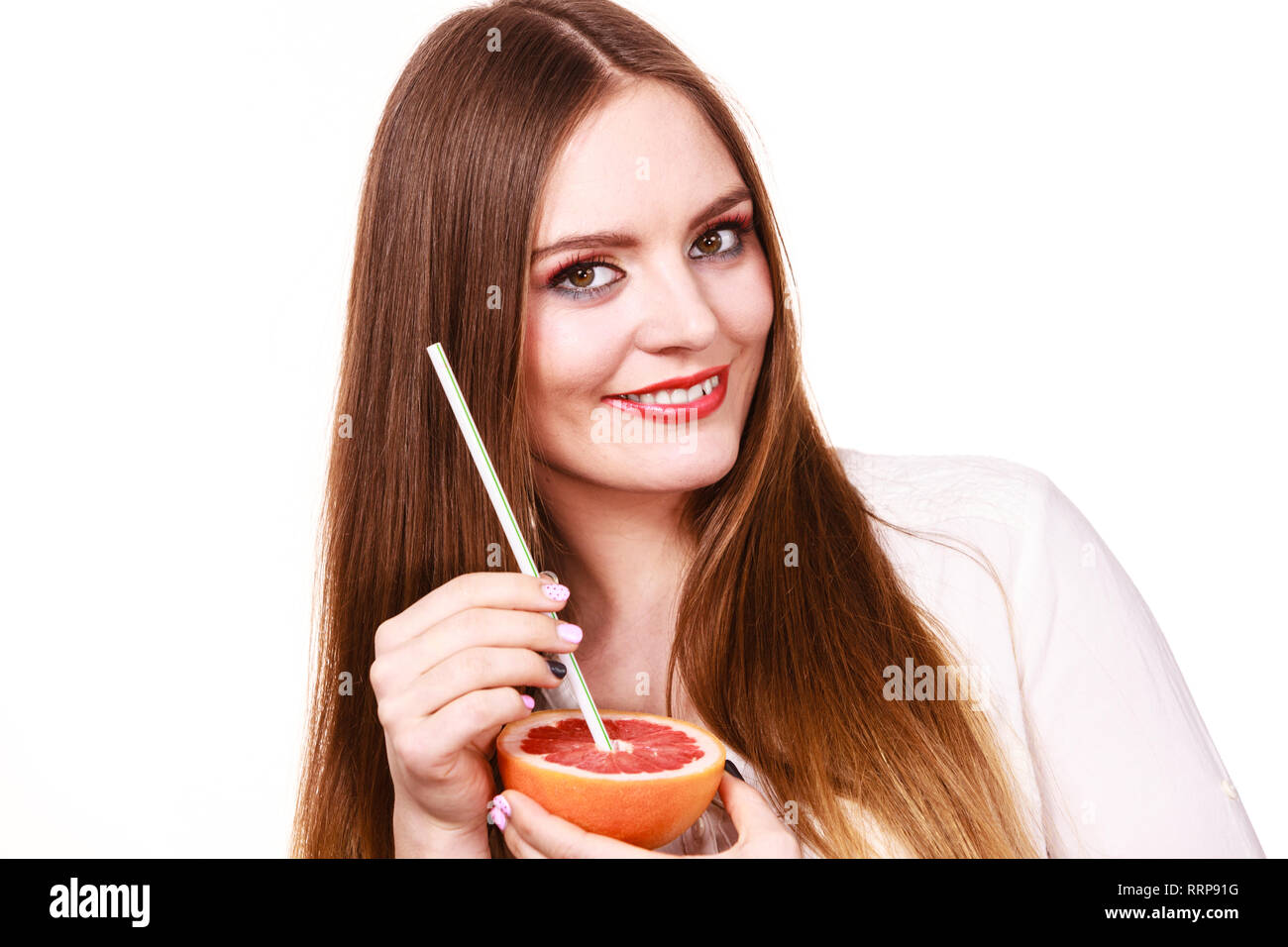 Woman attractive long hair girl colorful eyes makeup holding grapefruit ...