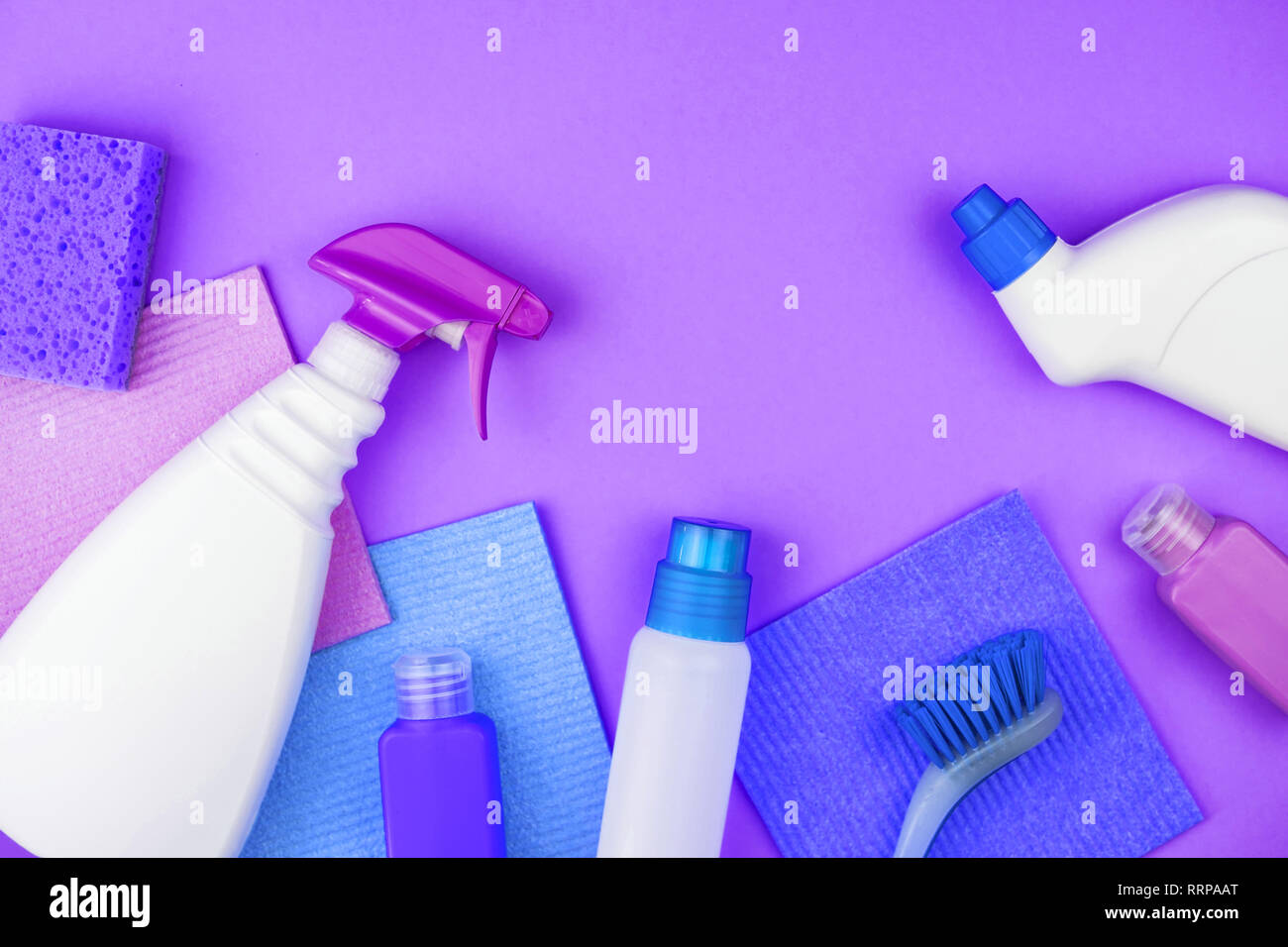 House cleaning products are on purple background Stock Photo - Alamy
