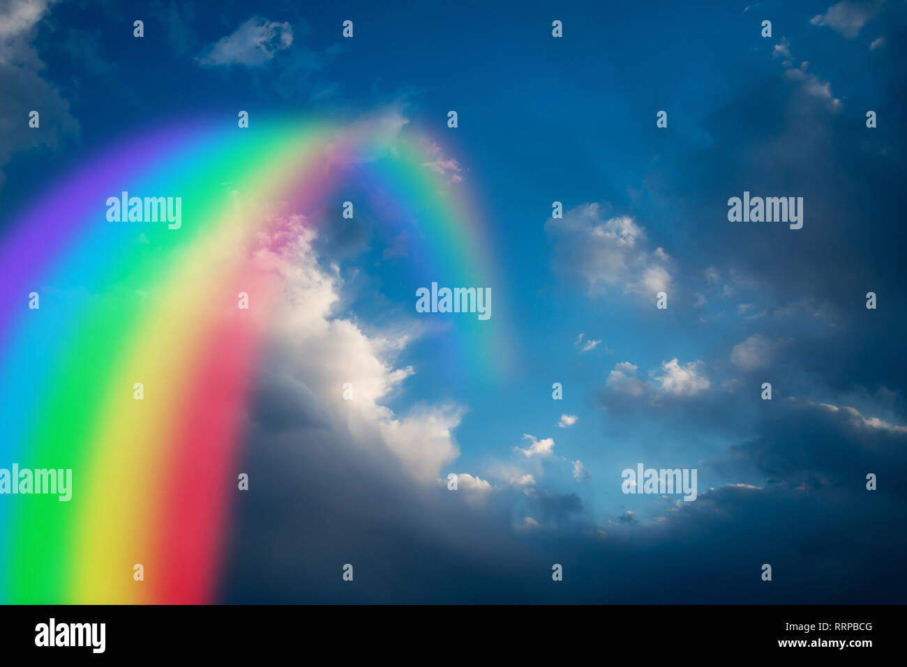 Colorful rainbow in clouds - beauty in nature concept Stock Photo - Alamy