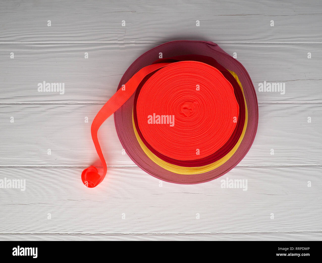 Ribbon of different colors in coils Stock Photo - Alamy