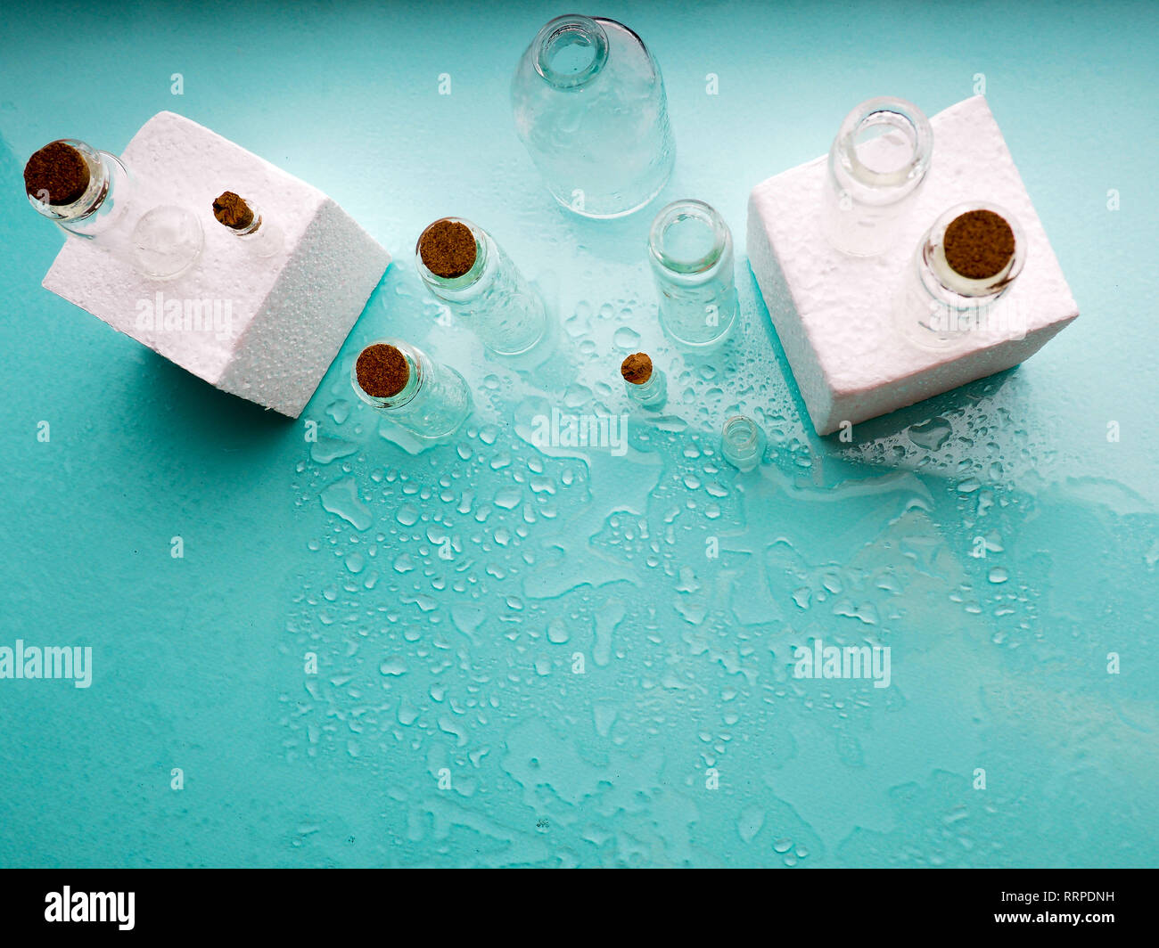Few transparent bottles, water sprays. empty glass bottles Stock Photo ...