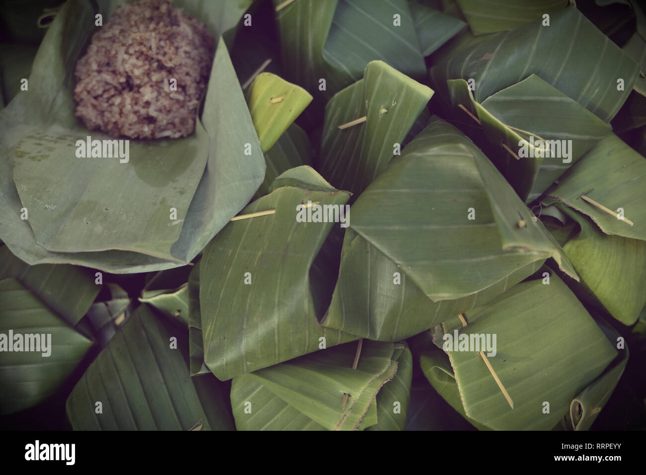 Banana leaf wrapped rice, thai food Stock Photo - Alamy