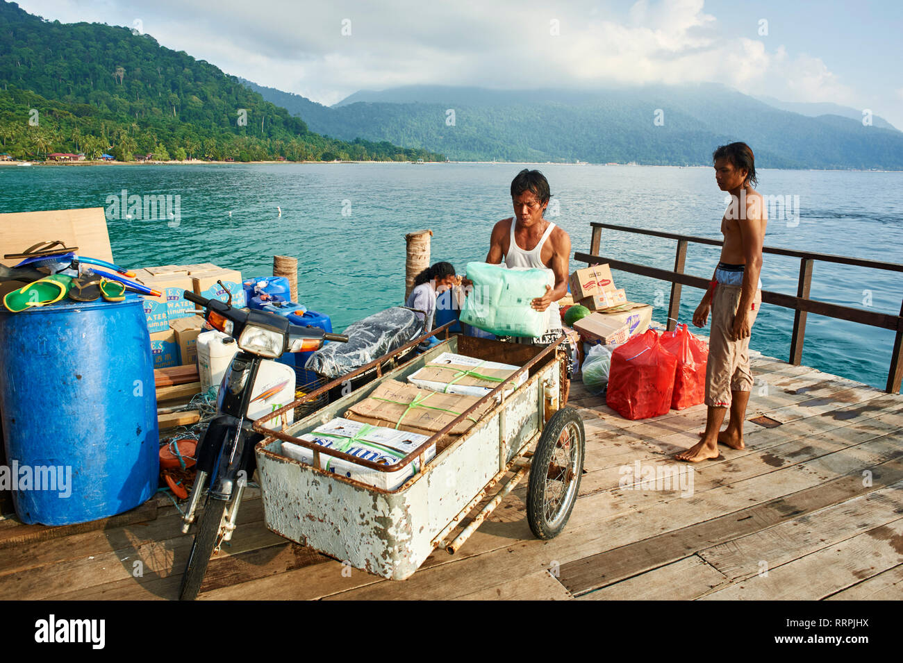 unloading the supply boat from the end of the Panuba jetty and ...