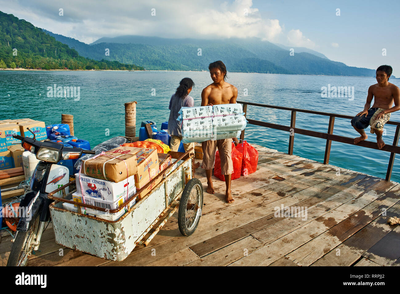 unloading the supply boat from the end of the Panuba jetty and ...