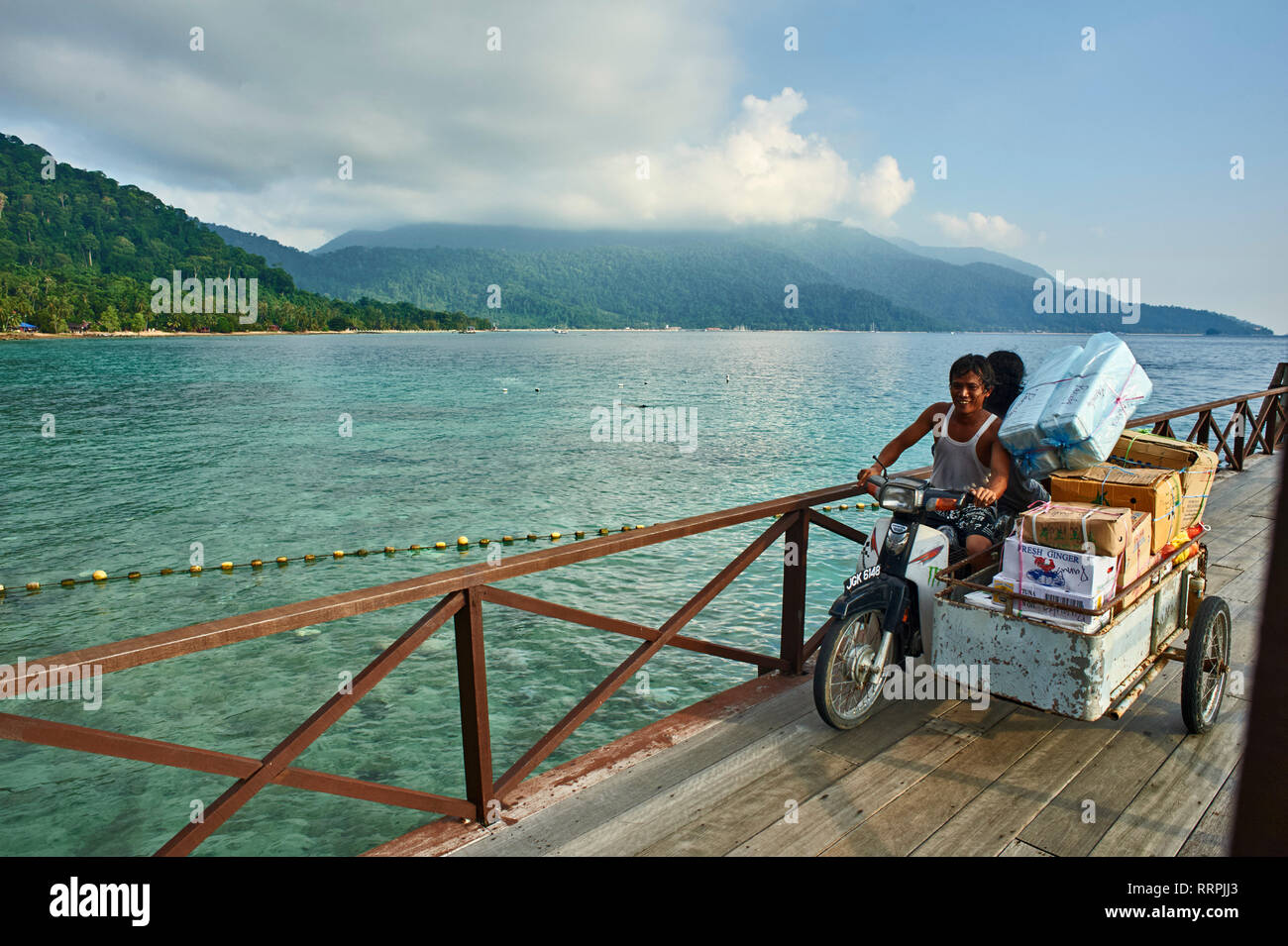 unloading the supply boat from the end of the Panuba jetty and ...