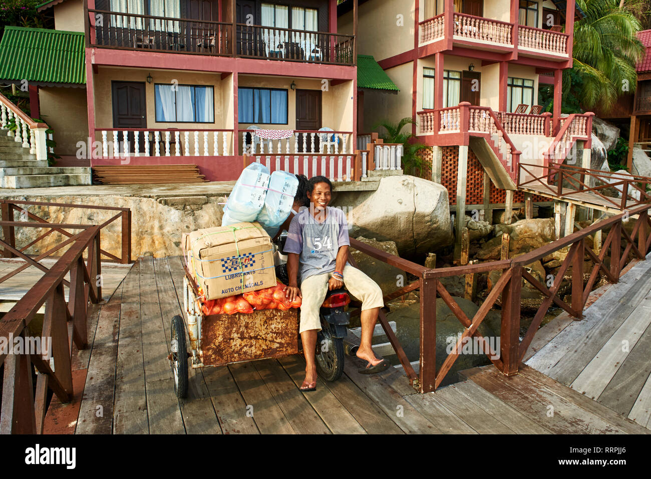 unloading the supply boat from the end of the Panuba jetty and ...