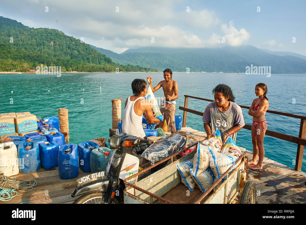 unloading the supply boat from the end of the Panuba jetty and ...