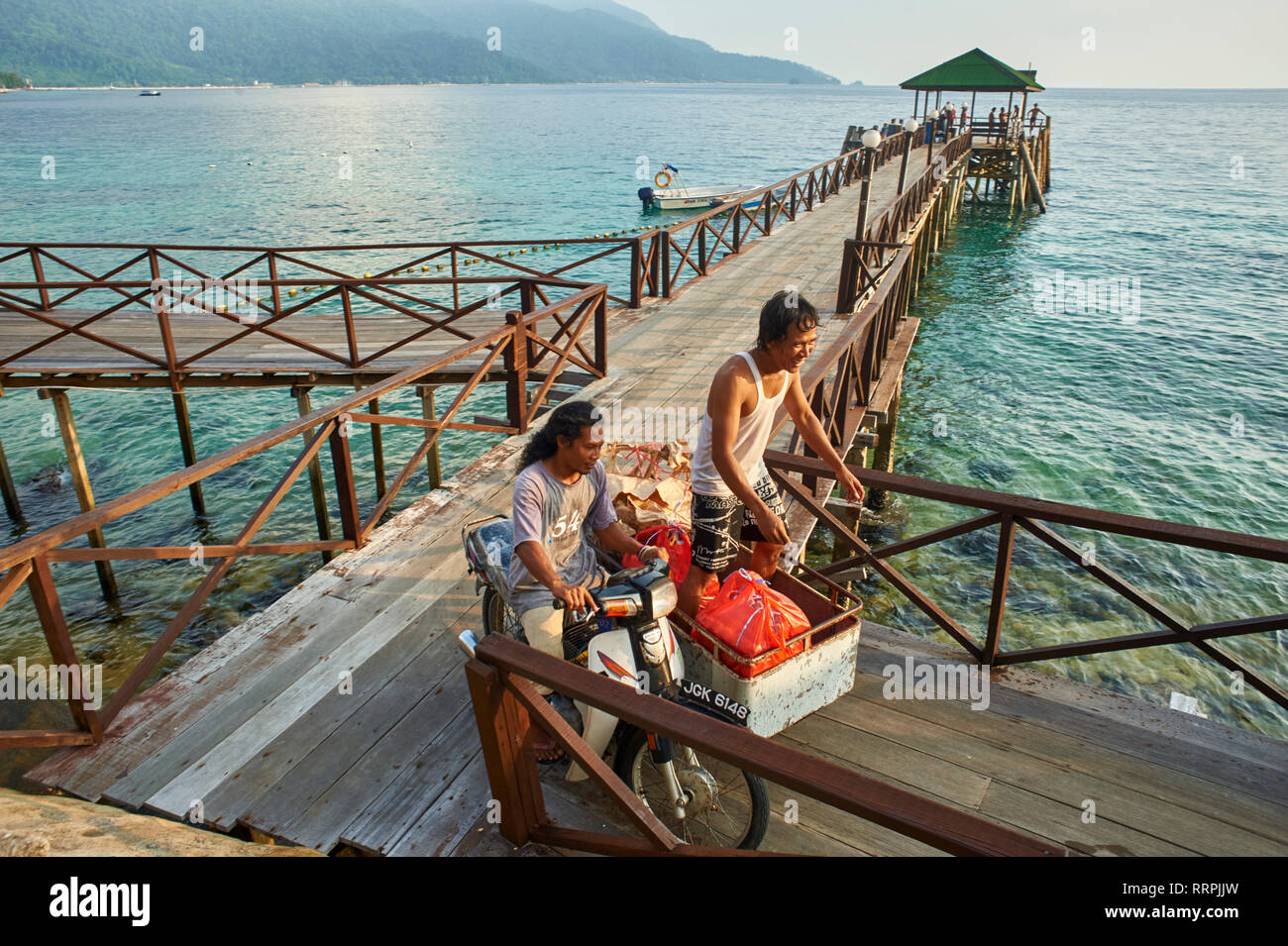 unloading the supply boat from the end of the Panuba jetty and ...