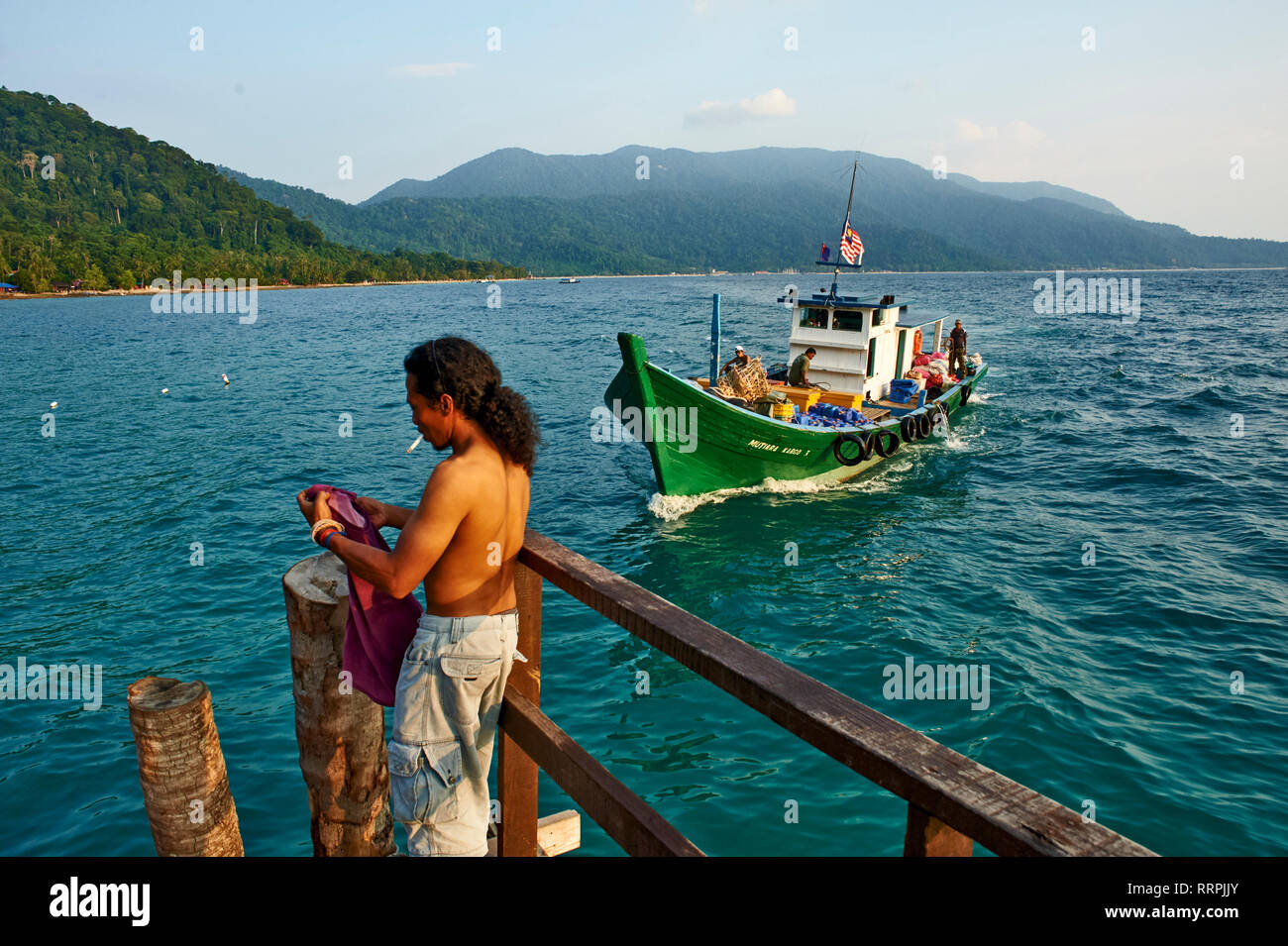 the supply boat arrive at the Panuba jetty in Tioman Island, Malaysia ...