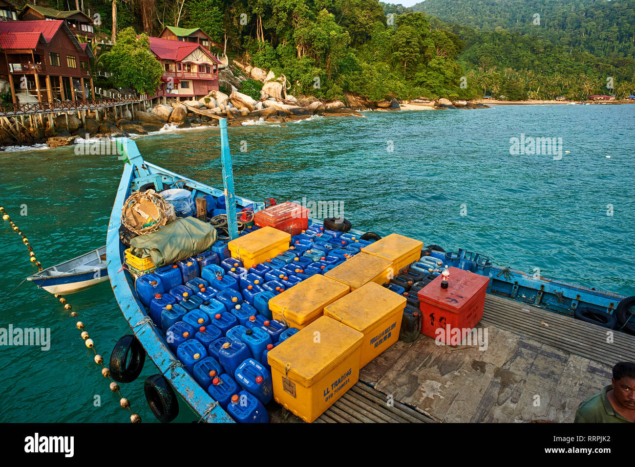 unloading of the supply boat from the end of the Panuba jetty in Tioman ...