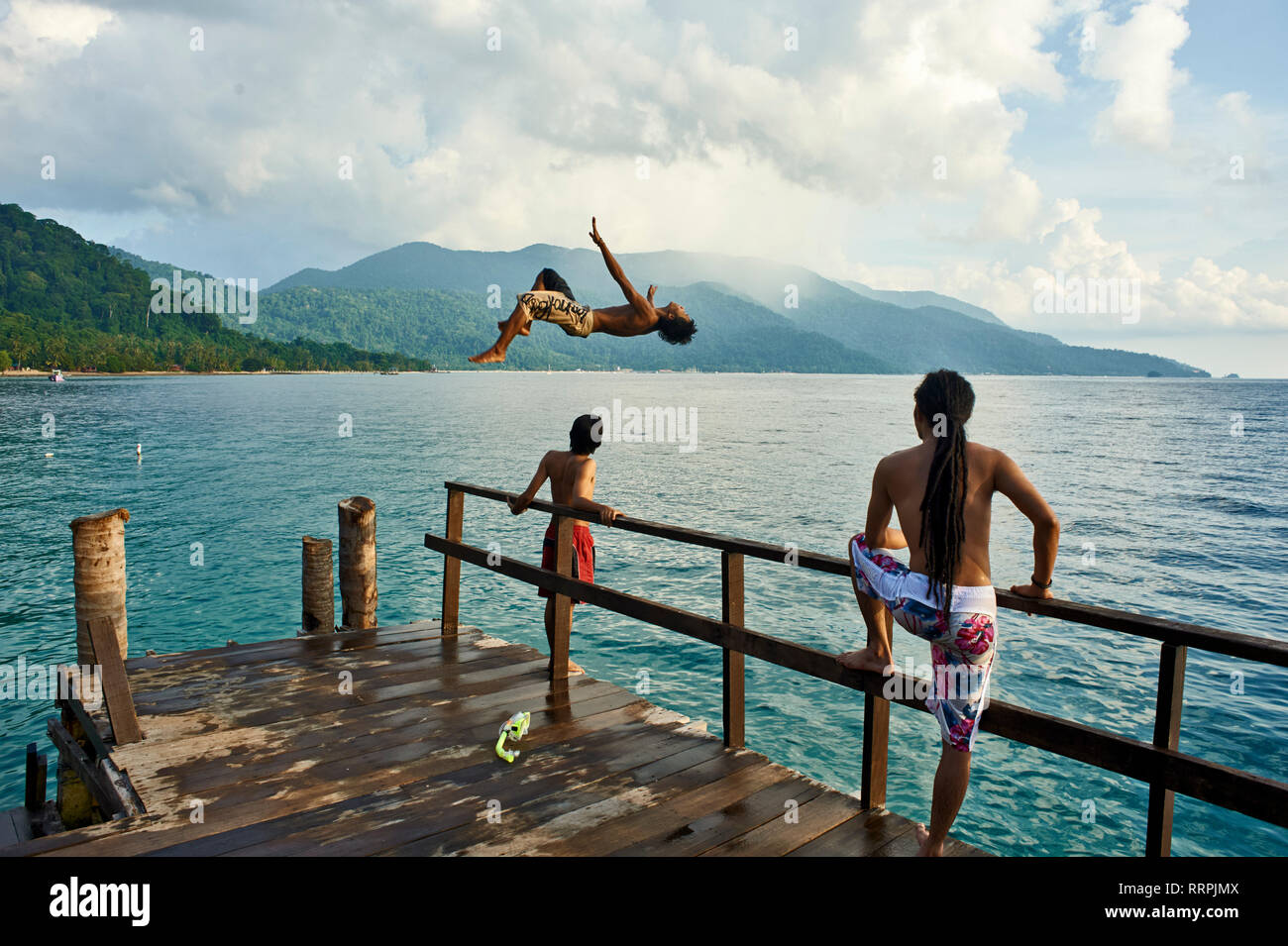 Resort staff has fun jumping into the water from the end of the Panuba ...