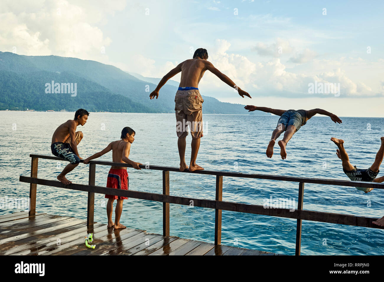 Resort staff has fun jumping into the water from the end of the Panuba ...