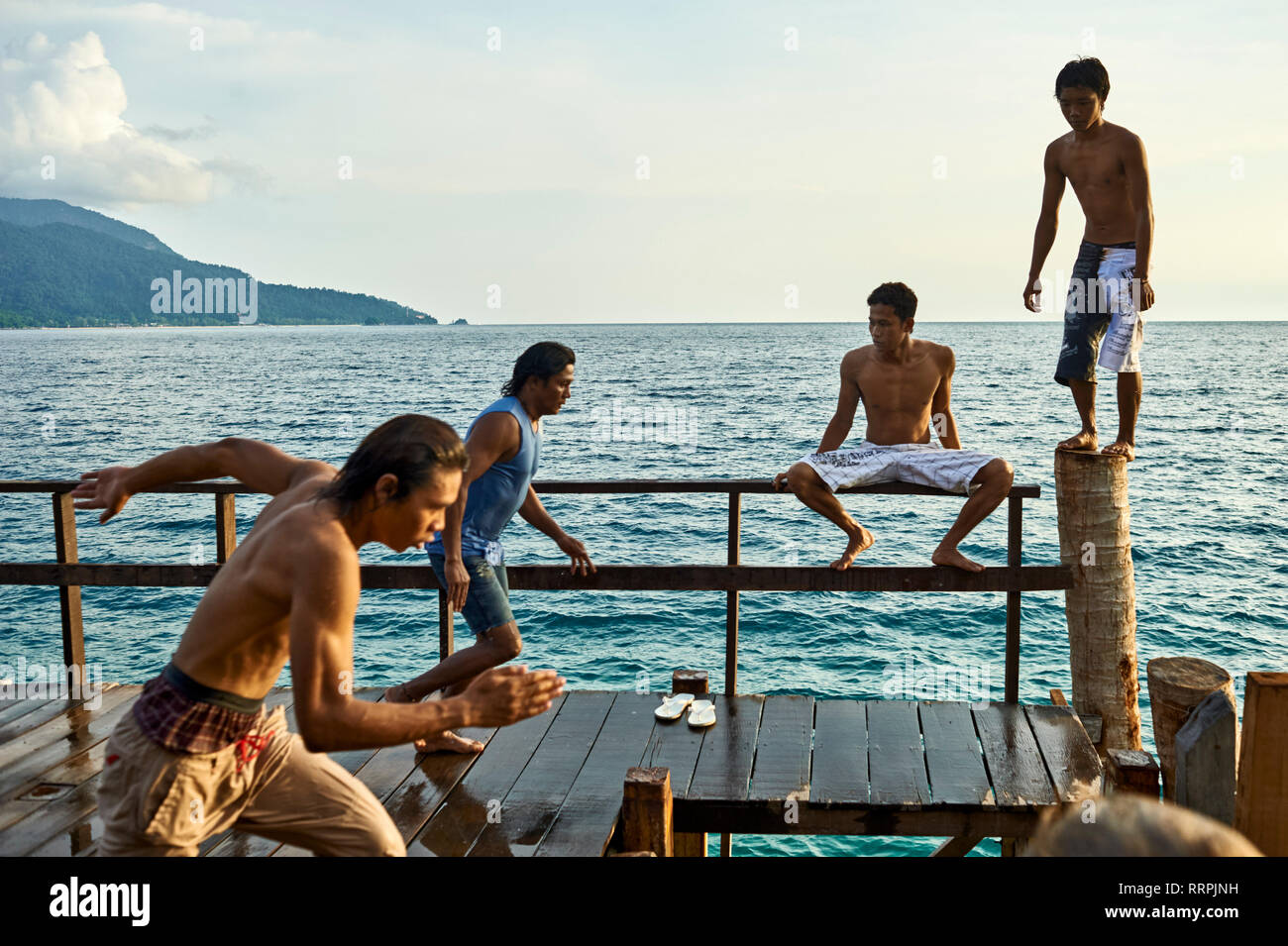 Resort staff has fun jumping into the water from the end of the Panuba ...