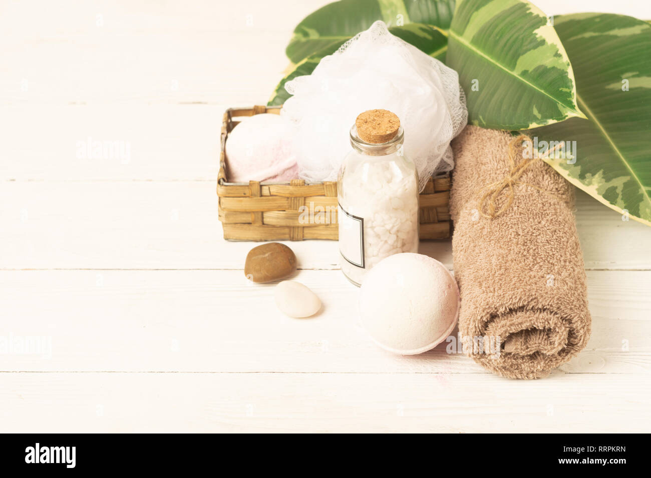 A set of items for the spa procedures. Bath salt, towel, sponge on the ...