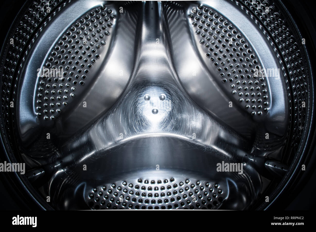 Clean drum of a modern washing machine close up Stock Photo - Alamy