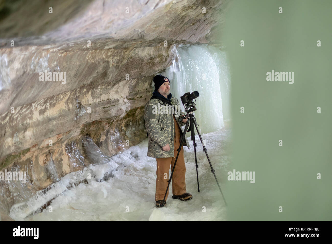 Eben Junction, Michigan - A photographer inside the Eben Ice Caves ...