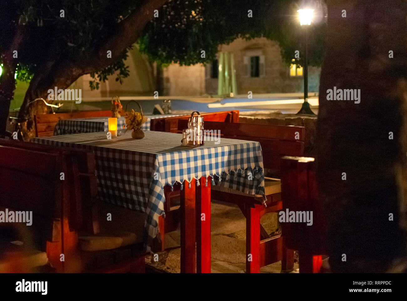 Image of empty dining tables in evening Stock Photo - Alamy