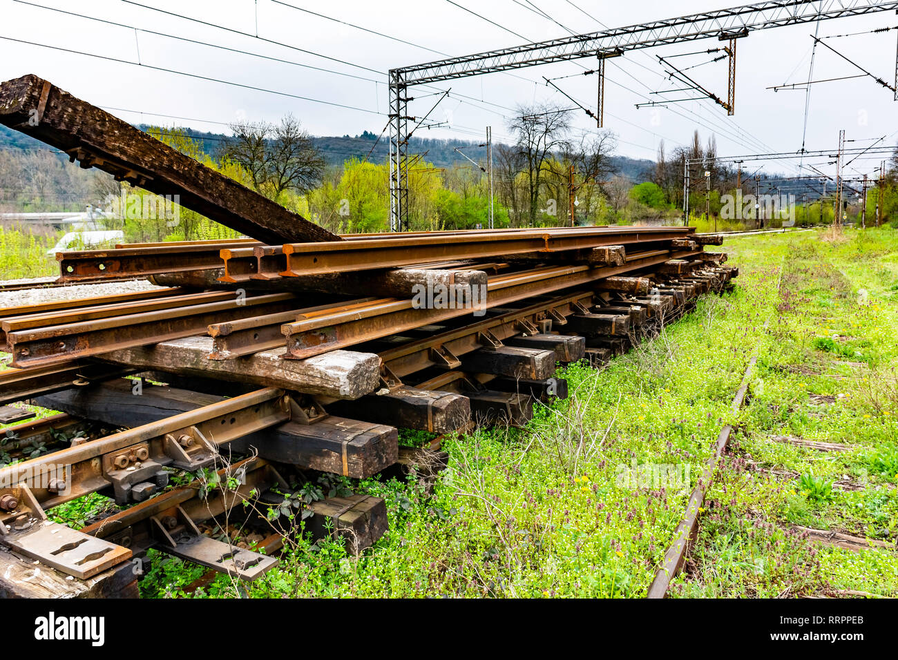 Demounted disassembled old unused railroad tracks and sleepers ...
