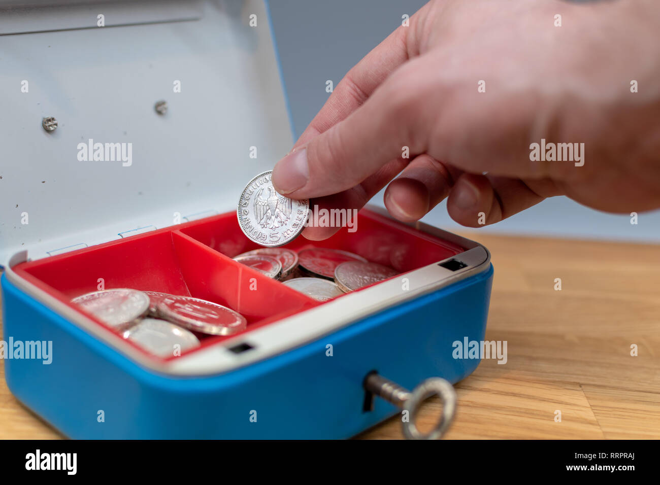 Coin money box hand not piggy bank hi-res stock photography and images ...