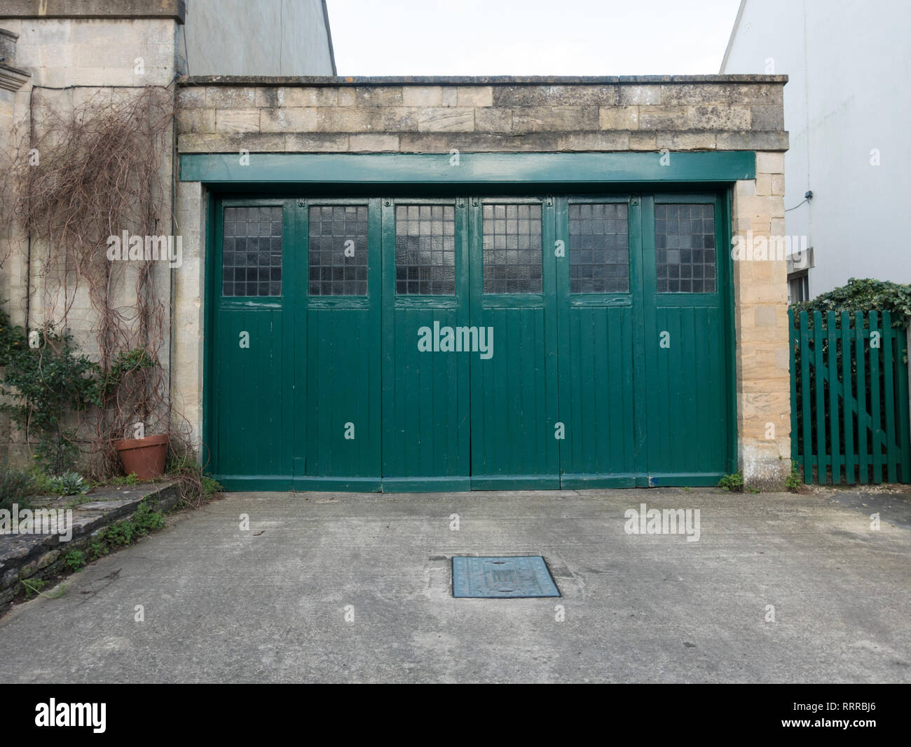 Green garage door Stock Photo - Alamy