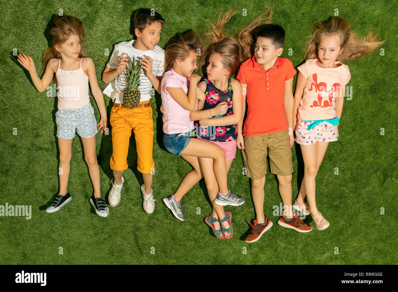 Group of happy children playing outdoors. Kids having fun in spring ...
