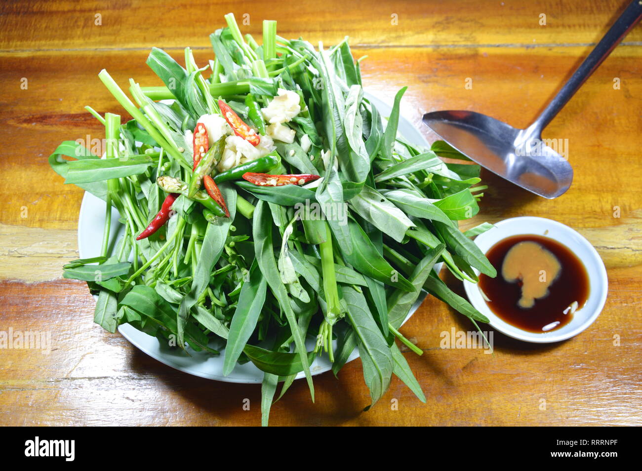 morning glory and sauce with iron flipper prepare to cook Stock Photo ...