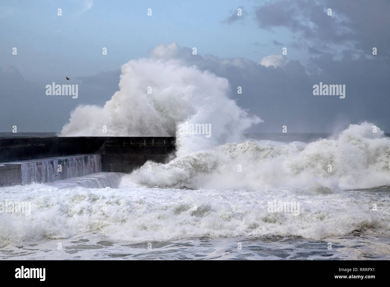 Wave over pier. Northern portuguese coast Stock Photo - Alamy