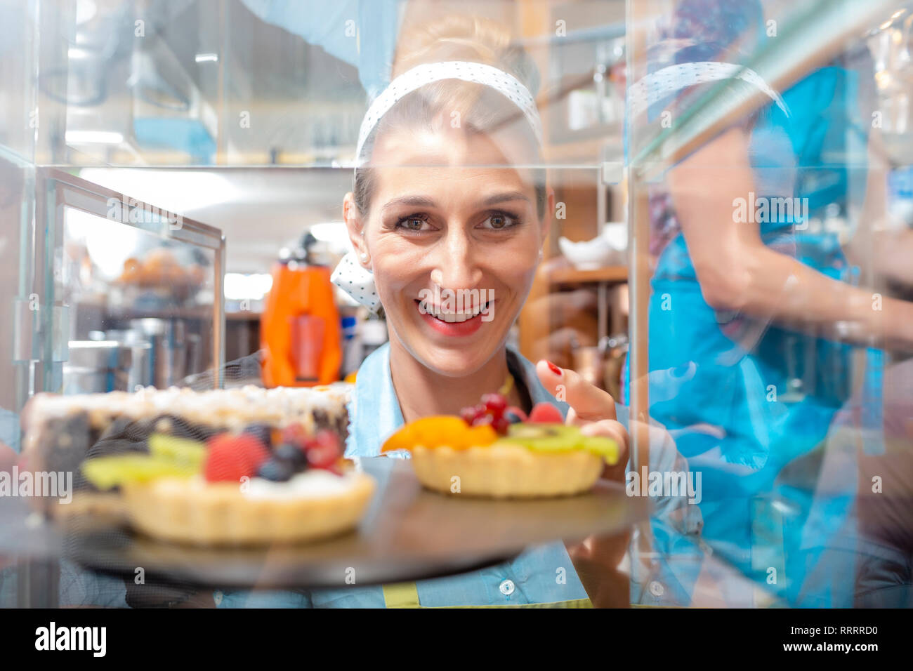 Woman in sweets shop hi-res stock photography and images - Alamy