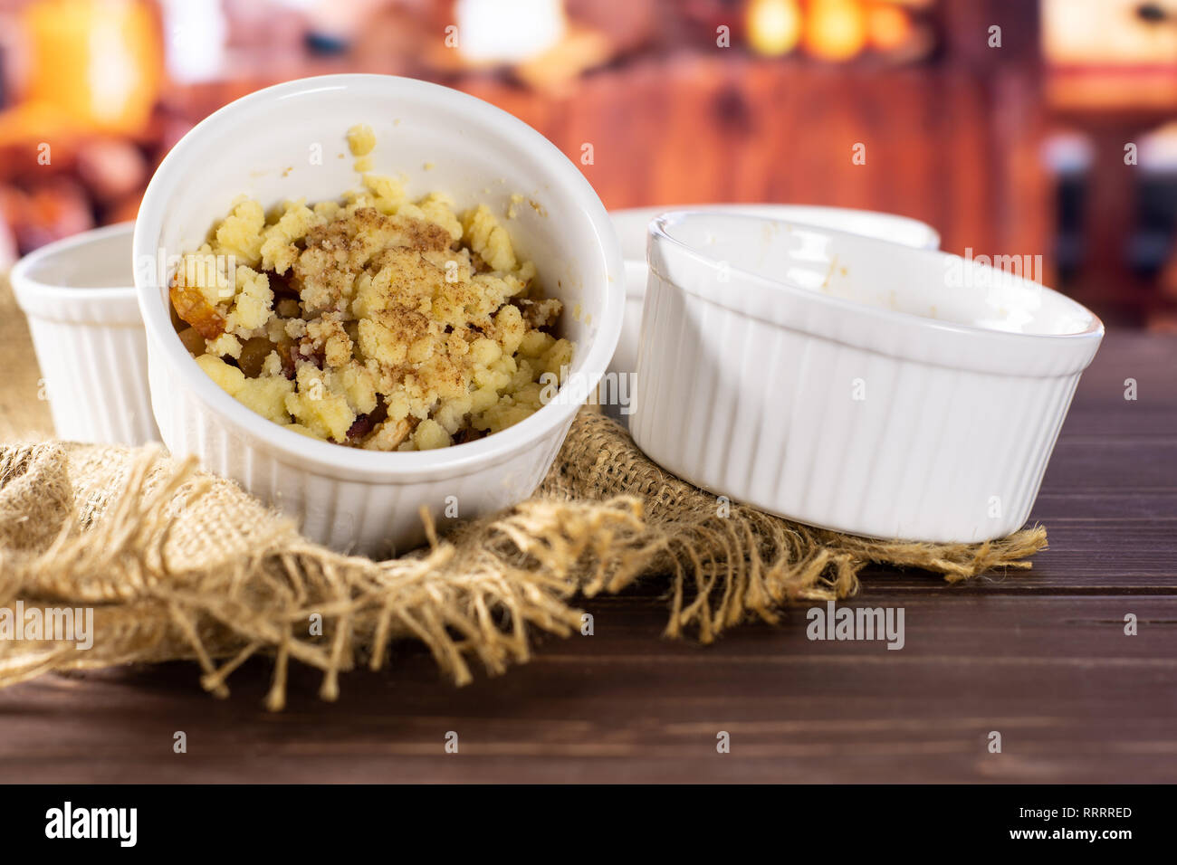 Recipe step by step crumble with fruits in a ceramic ramekin with ...