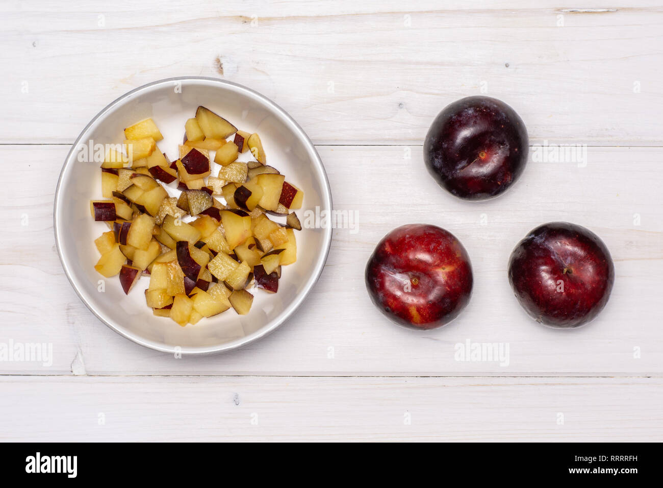 Chopped and mixed plums. recipe step by step crumble with fruits ...