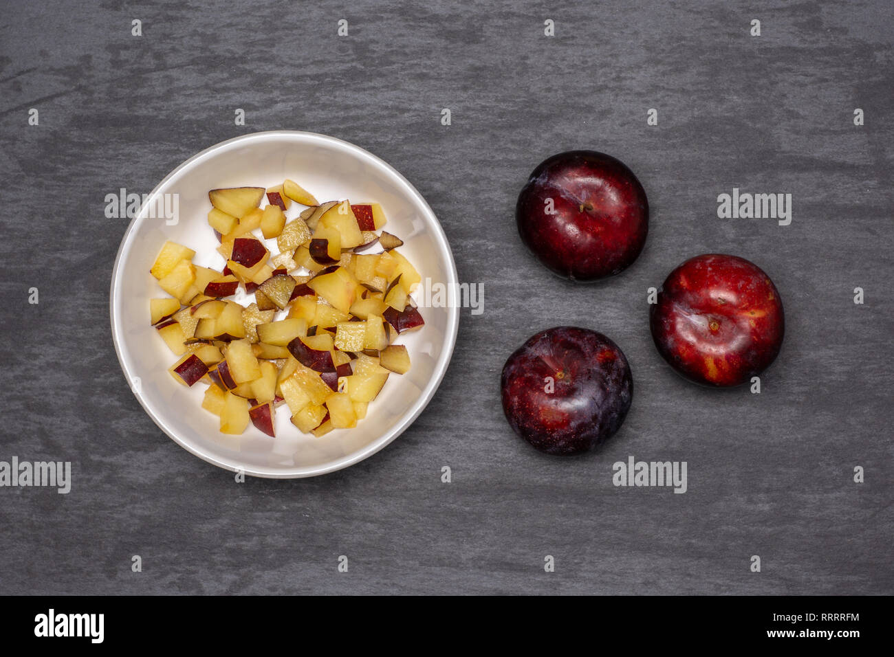 Chopped and mixed plums. recipe step by step crumble with fruits ...