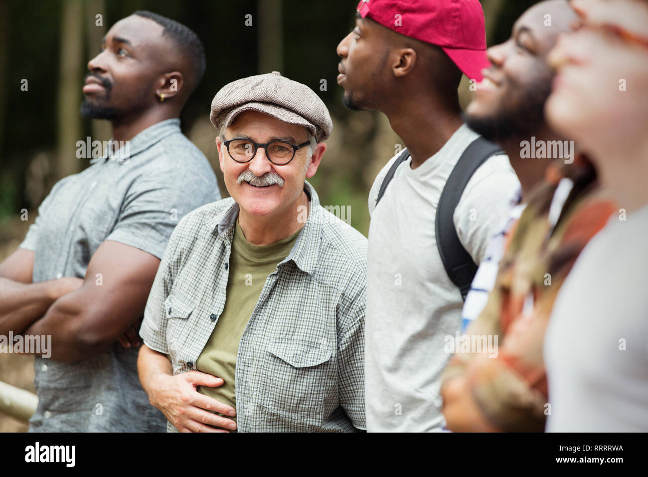Portrait smiling senior man with mens group Stock Photo - Alamy