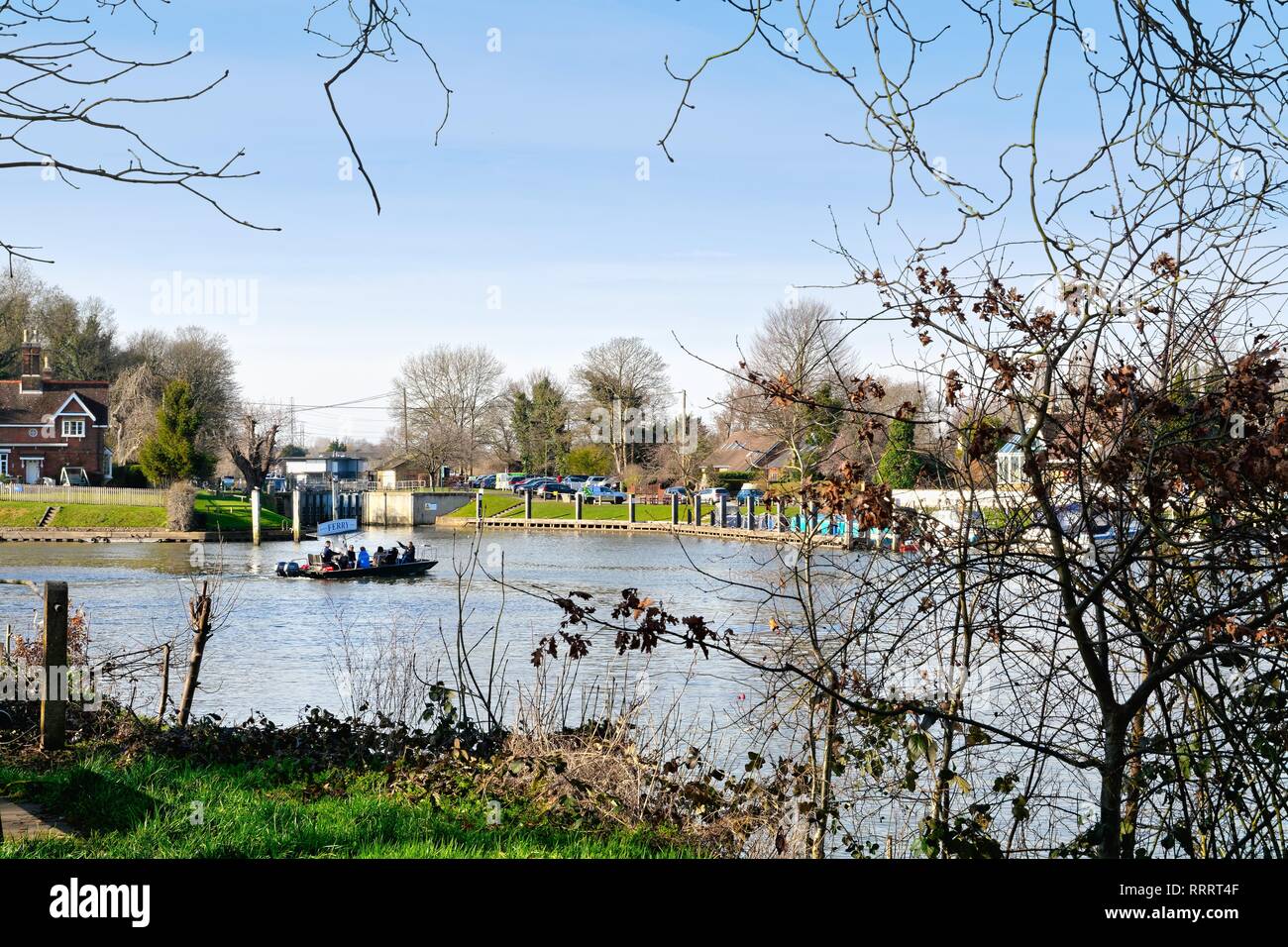 The River Thames lock at Shepperton with the passenger ferry crossing ...