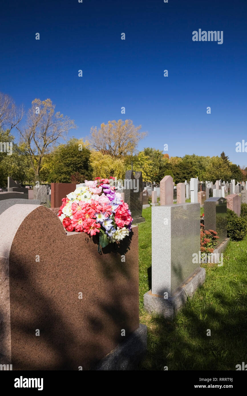Rows of gravestones at Notre-Dame-des-Neiges cemetery on Mount Royal in ...