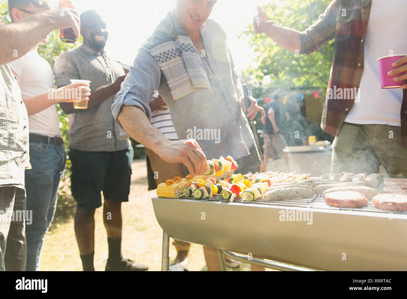 Barbecuing hi-res stock photography and images - Alamy