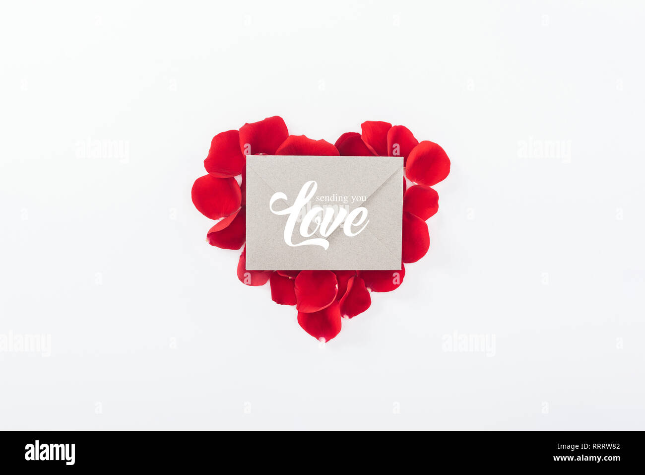 top view of envelope with "sending you love" lettering and heart made ...