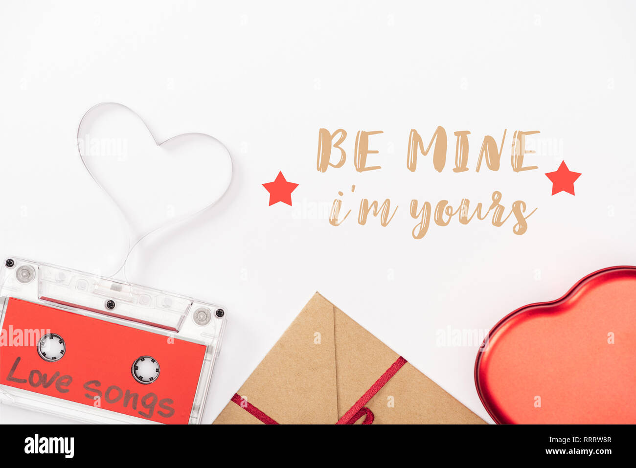 top view of audio cassette with 'love songs' lettering and heart symbol ...