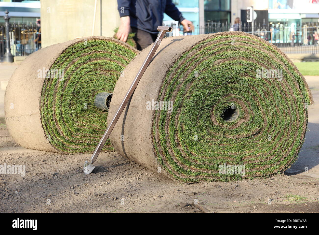 two Rolls of Turf Gardening tool and gardener Stock Photo - Alamy
