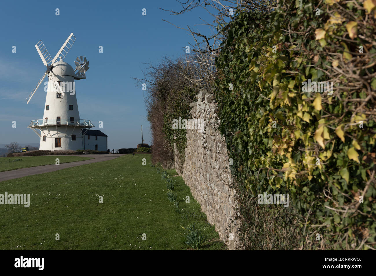 windmill with blue background dramatic light sky Stock Photo - Alamy