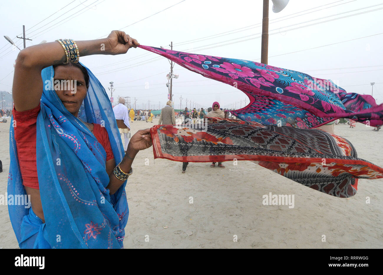 A hindu Indian women drying saree after taking a dip in sacred river ...
