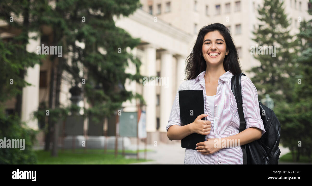 Happy beautiful student girl outdoor Stock Photo - Alamy