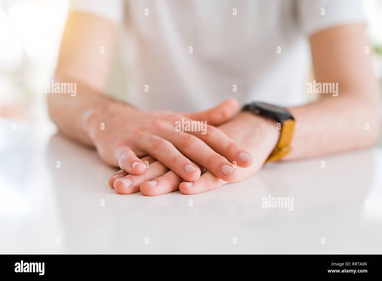Close up young man hands together Stock Photo - Alamy
