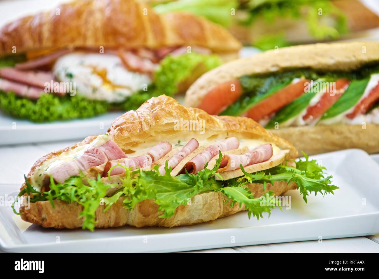 delicious sandwiches with different fillings Stock Photo - Alamy
