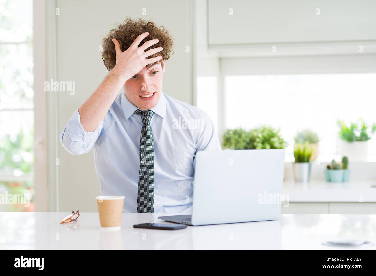 Young business man working with computer laptop at the office stressed ...