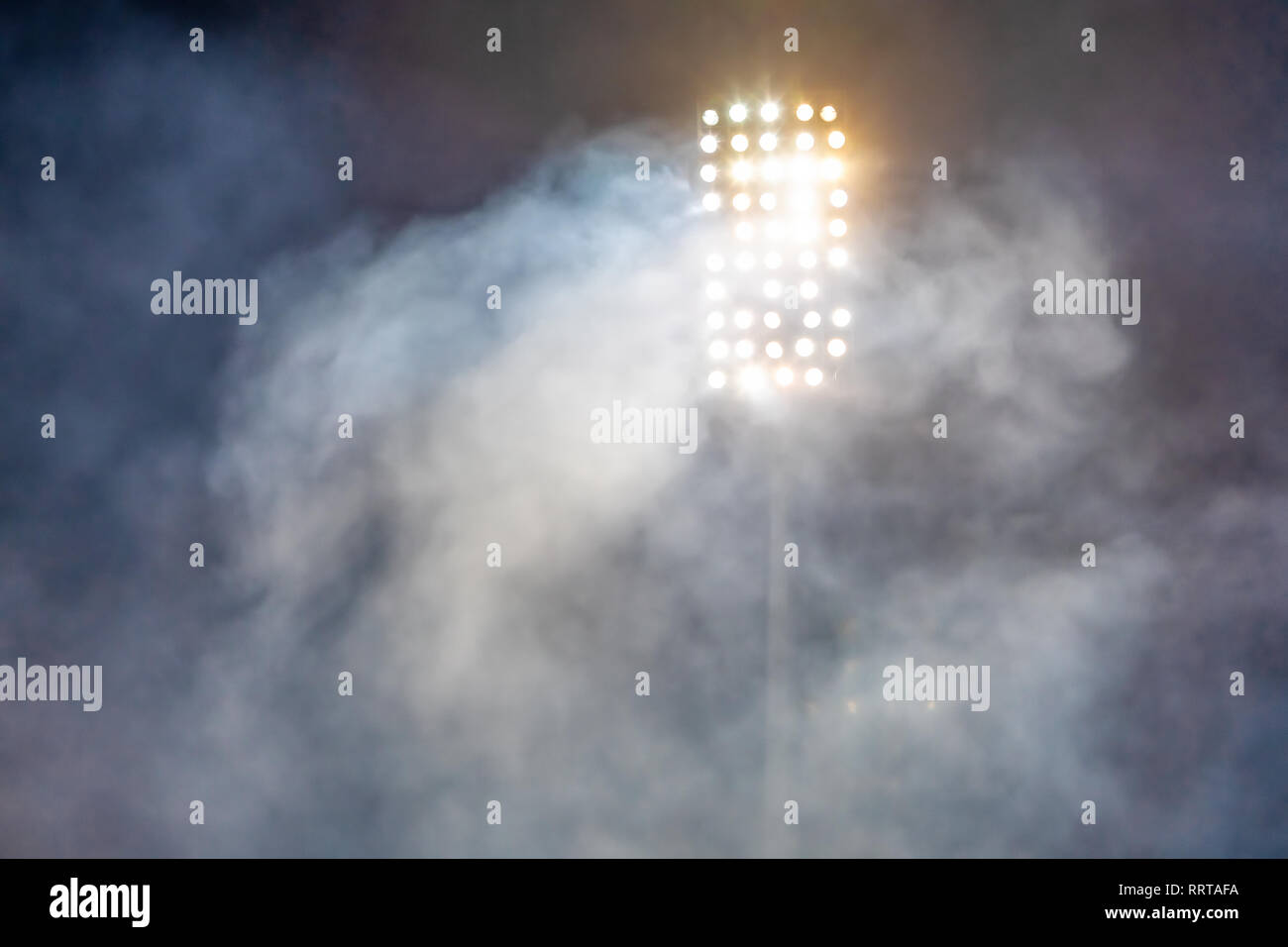 stadium lights and smoke Stock Photo - Alamy