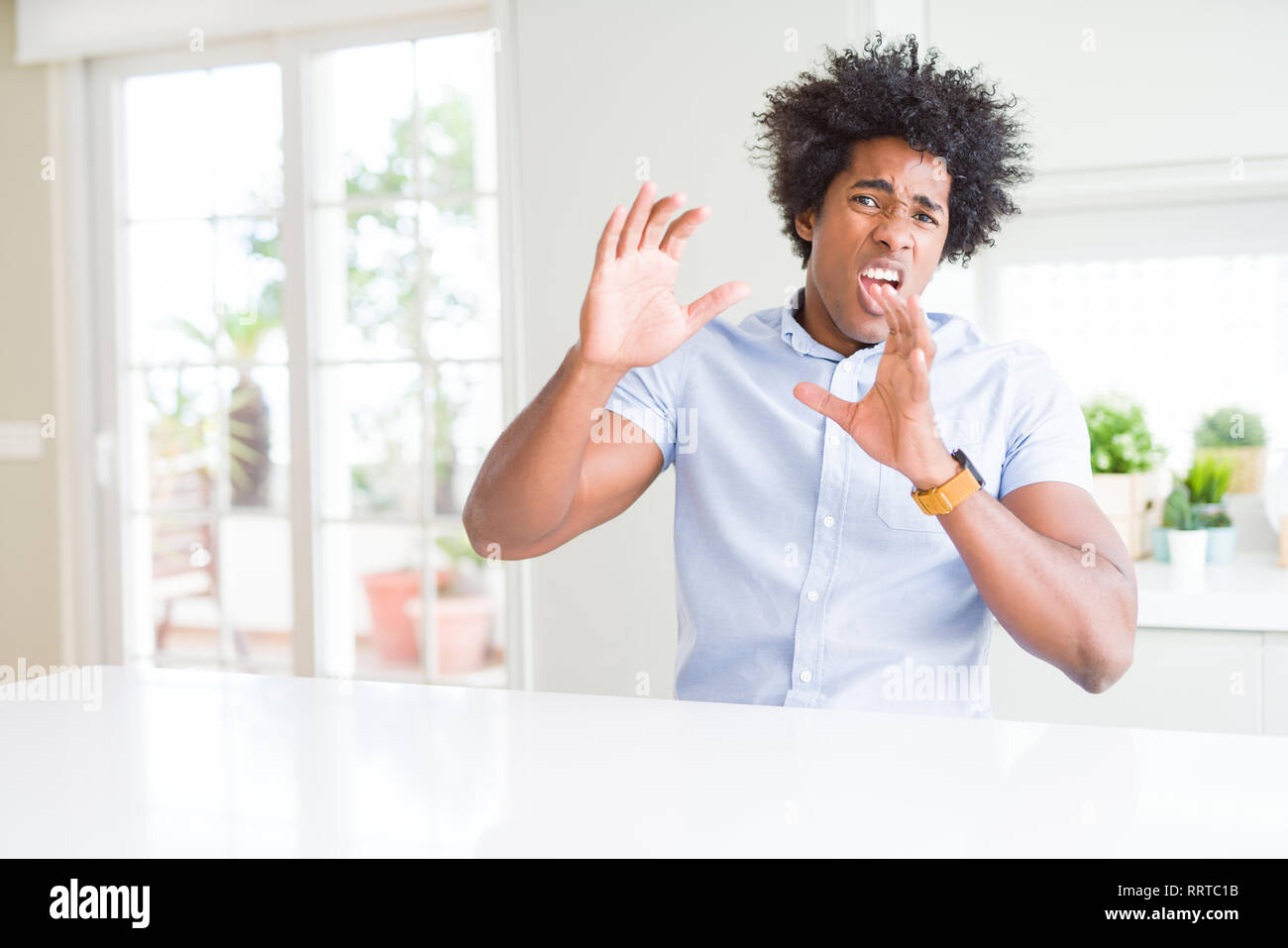 African American business man afraid and terrified with fear expression ...