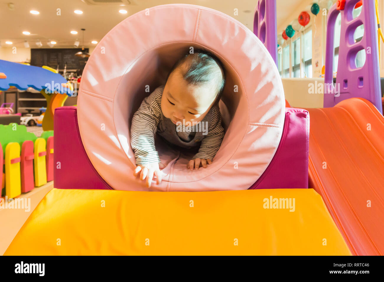 Cute Asian Korean baby playing on the indoor playground Stock Photo - Alamy