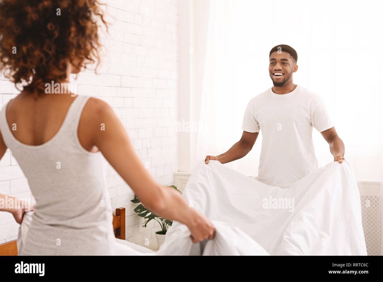 Young couple making love bed hi-res stock photography and images - Alamy