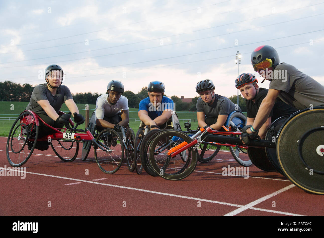 Portrait confident, determined paraplegic athletes training for ...